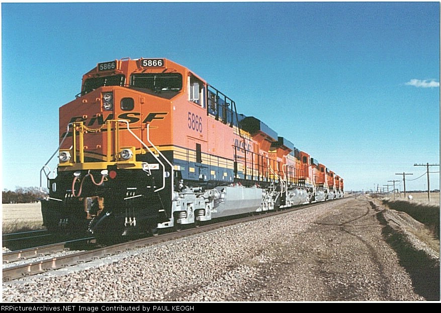BNSF 5866 at Aurora, Ne rolling west to the powder river area as the lead unit of six brand neww ...